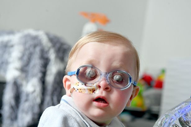 'My baby son's living in agony and unable to see but no-one can tell us ...