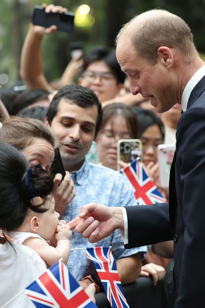 Adorable Moment Baby Bites Prince William's Finger In Singapore