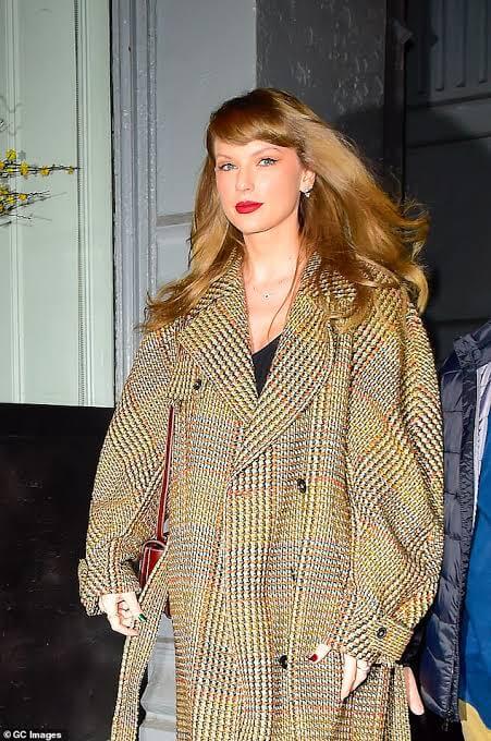 Taylor Swift is pretty in a FLIRTY plaid miniskirt and matching coat as ...