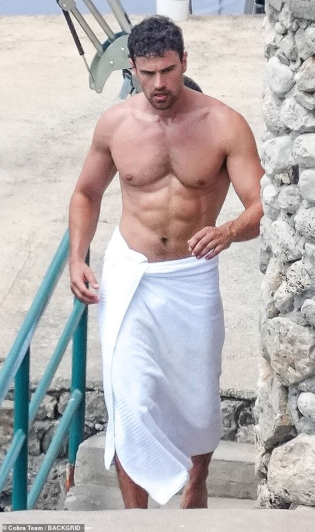 Shirtless Theo James shows off his HUNKY physique in a pair of white trunks as he films D&G advert