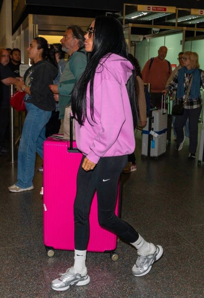 Katie Price flies back home to UK WITHOUT diamond wedding ring or husband